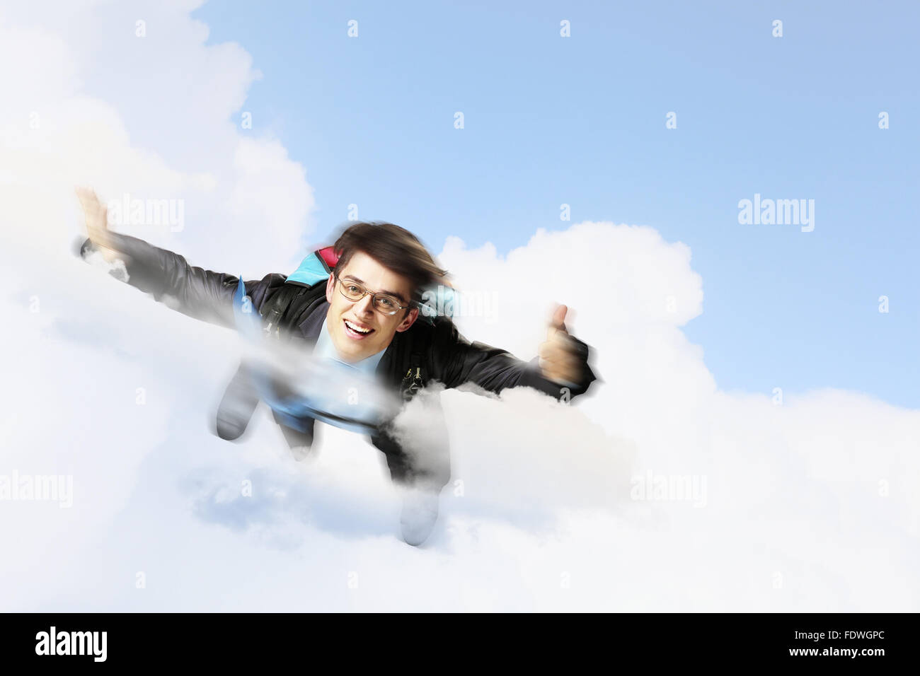 Conceptual image of young businessman flying with parachute on back ...