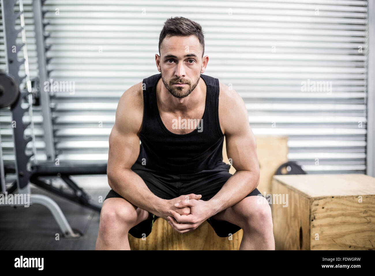Man sitting on box hi-res stock photography and images - Alamy