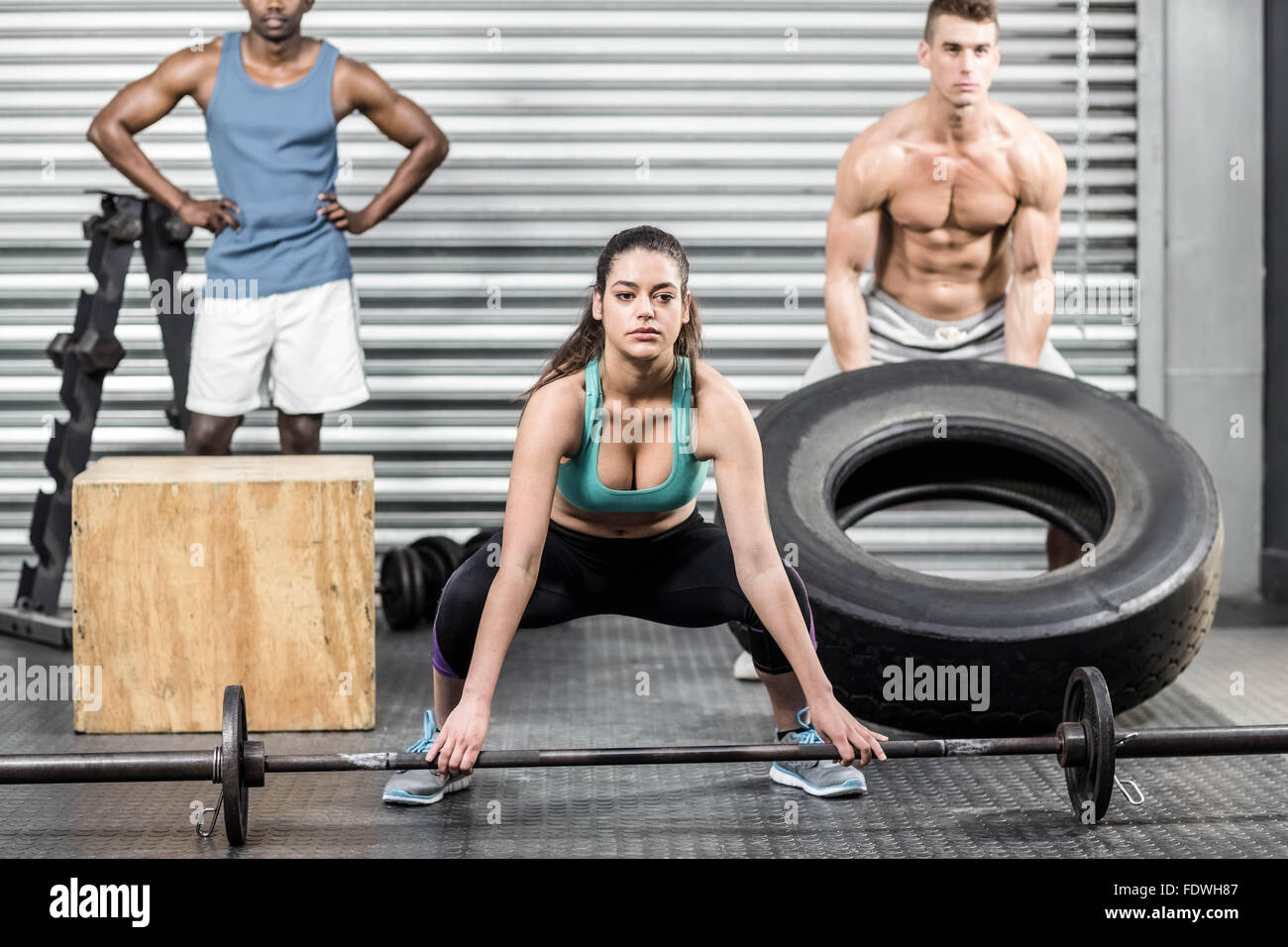 Fit people exercising together Stock Photo - Alamy