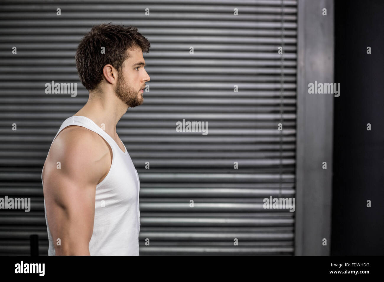 Serious fit man posing Stock Photo - Alamy