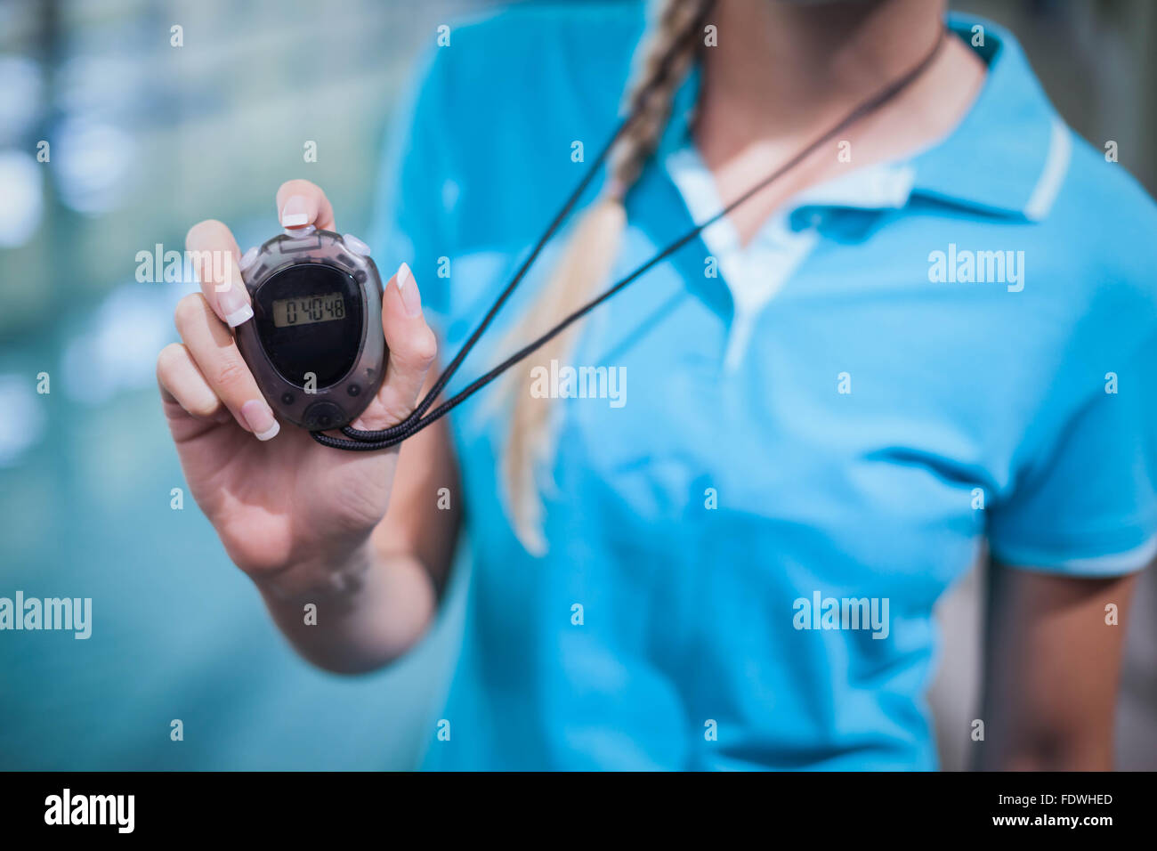 Fit trainer showing stopwatch hi-res stock photography and images - Alamy