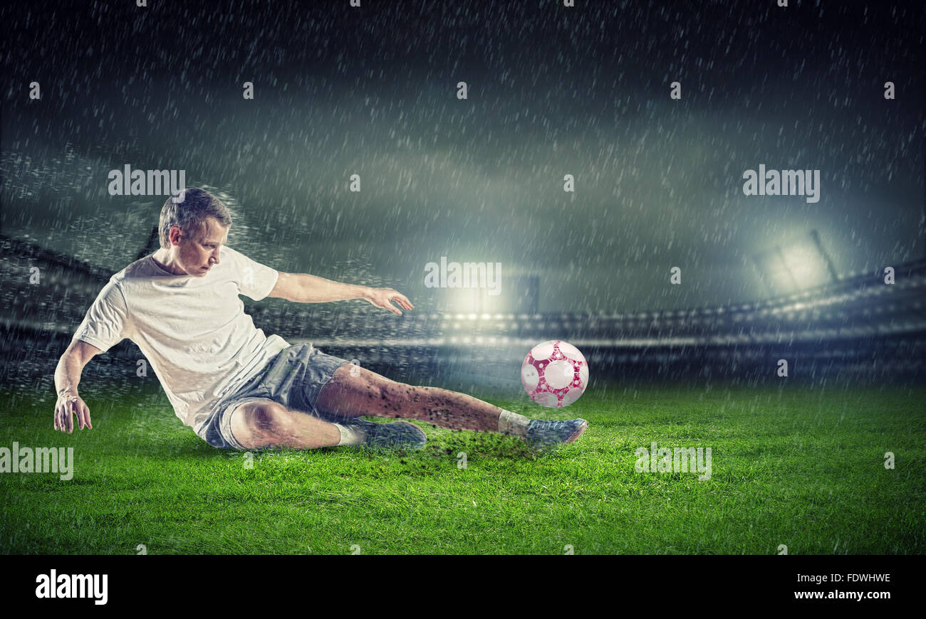 Football player stadium sliding hi-res stock photography and images - Alamy