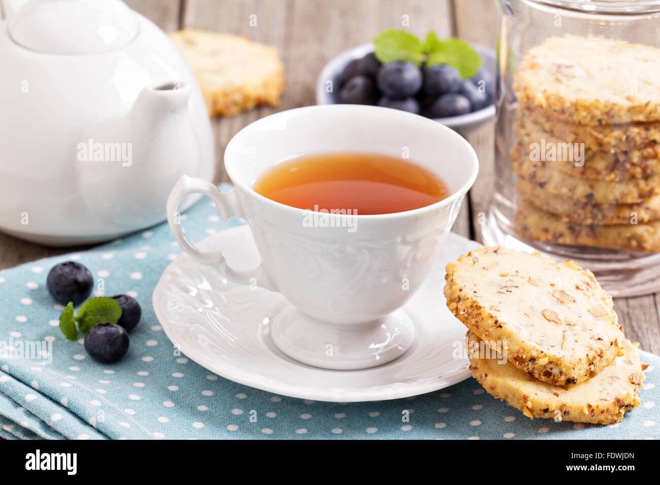 Walnut cookies with a cup of tea Stock Photo - Alamy