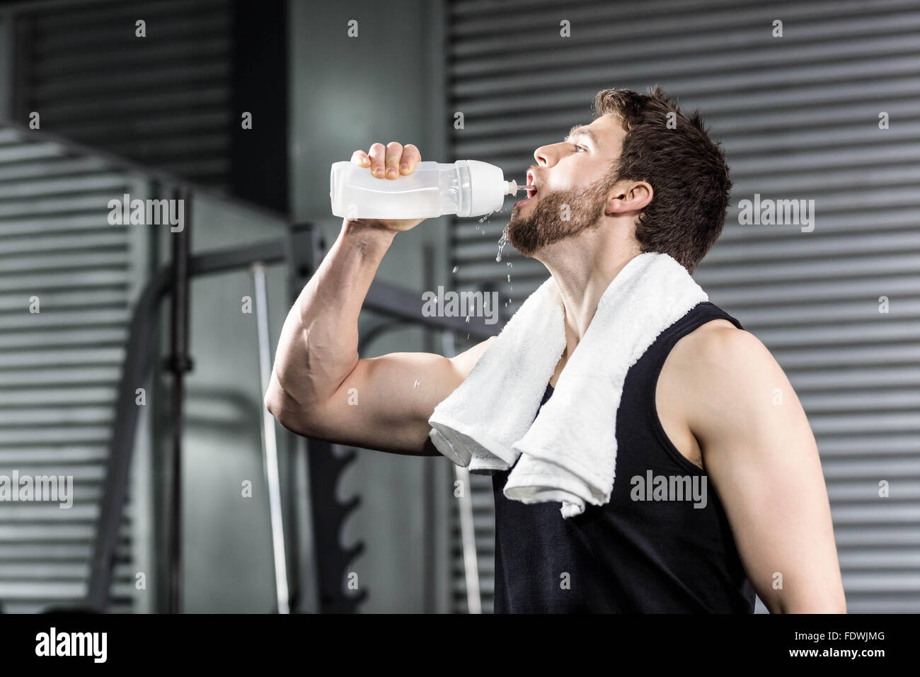 Fit man drinking water Stock Photo - Alamy