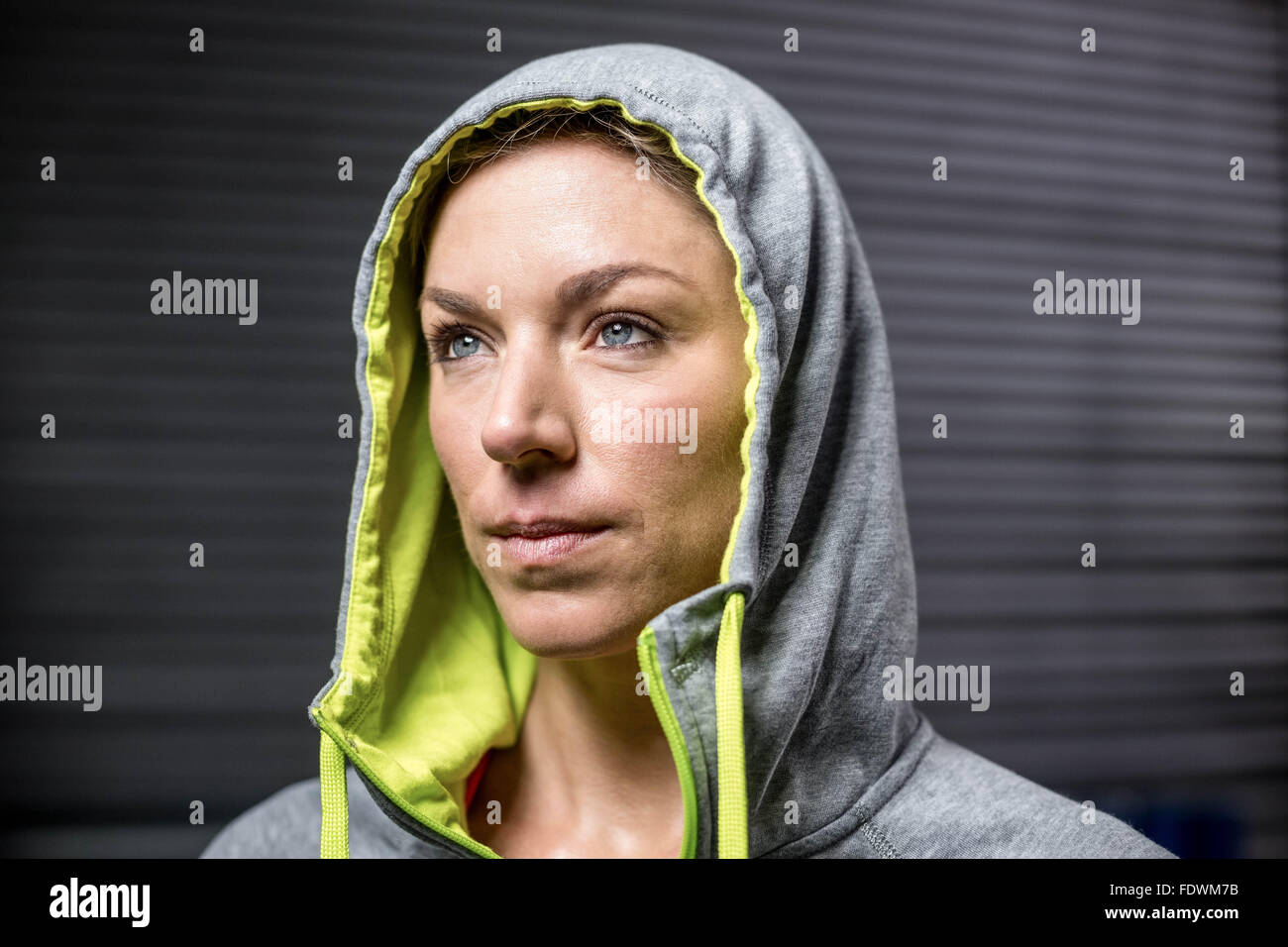 Portrait of woman wearing hood Stock Photo - Alamy