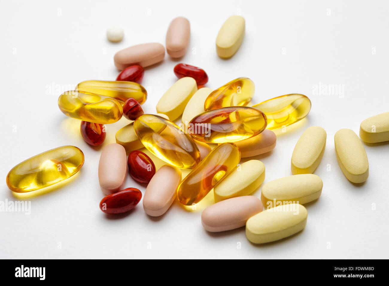 Mixture of dietary supplements capsules and pills isolated on white ...