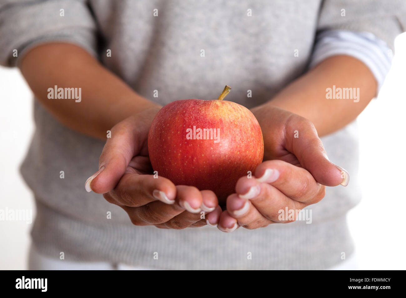 Handing holding out apple hi-res stock photography and images - Alamy