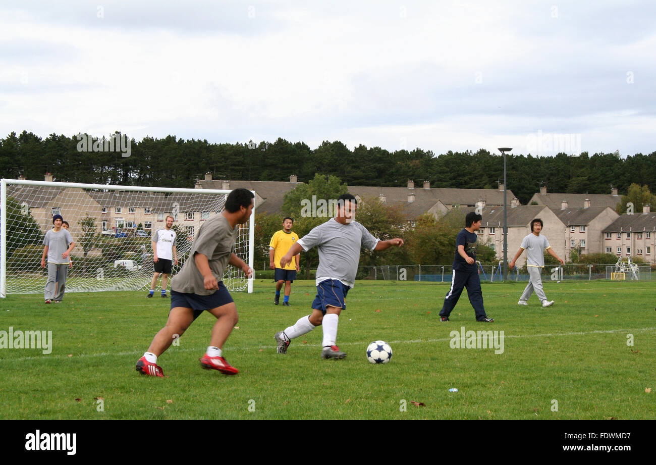 Playing a football match outside Stock Photo - Alamy