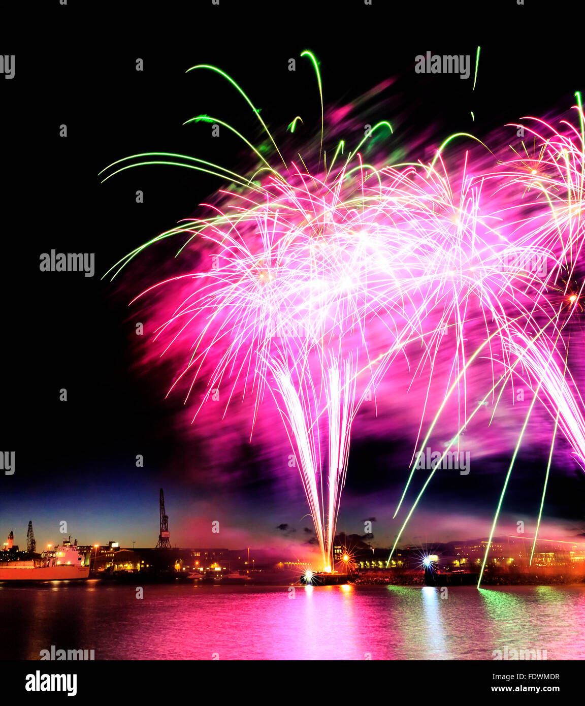 Fireworks display over water on New Year's Eve. Gothenburg harbor ...