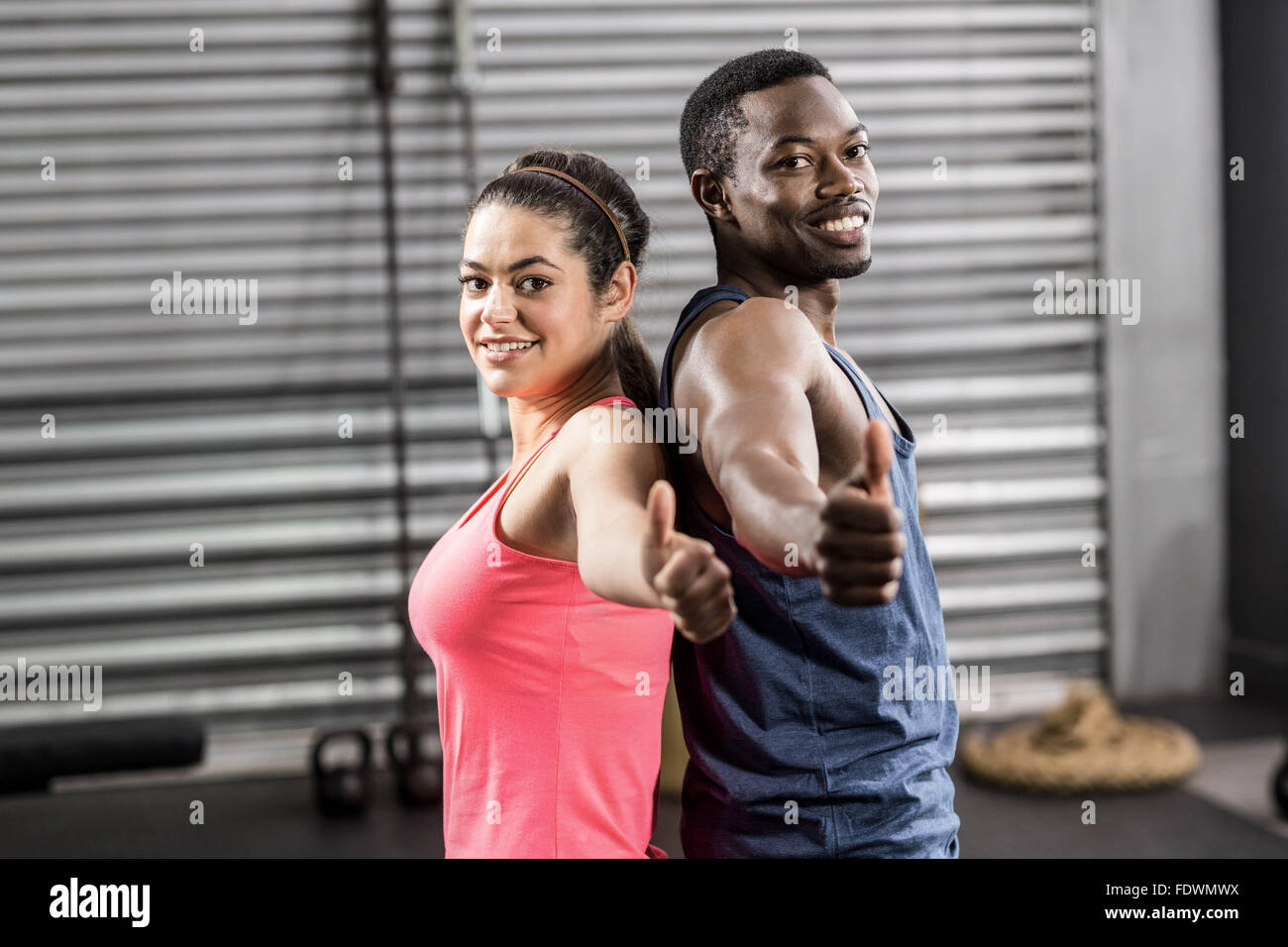 Couple back to back arms folded hi-res stock photography and images - Alamy