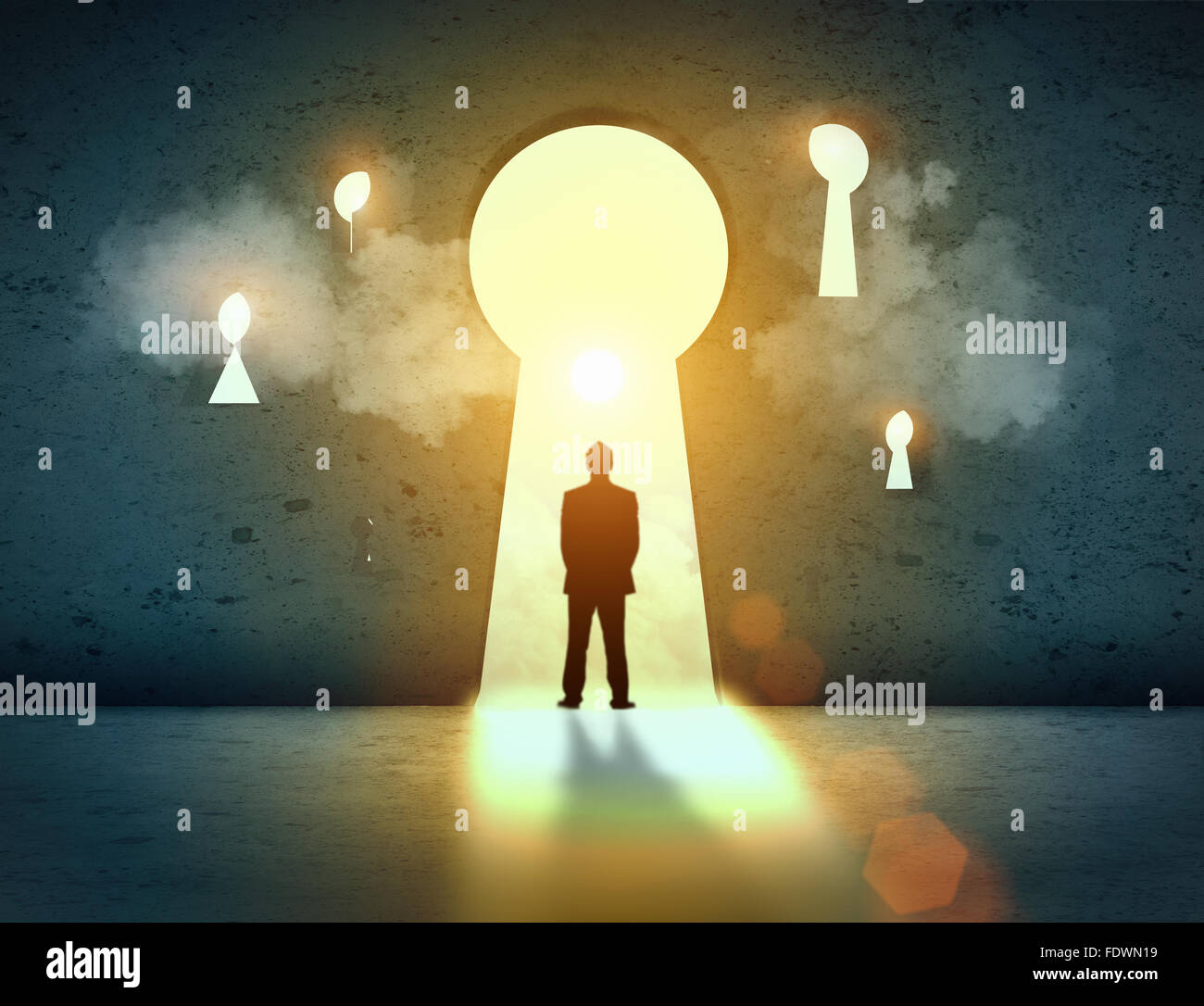 Silhouette of businessman standing in keyhole sun shining above Stock ...