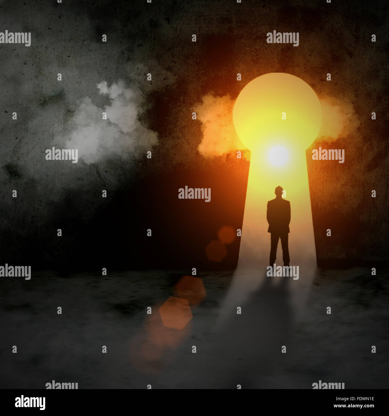 Silhouette of businessman standing in keyhole sun shining above Stock ...