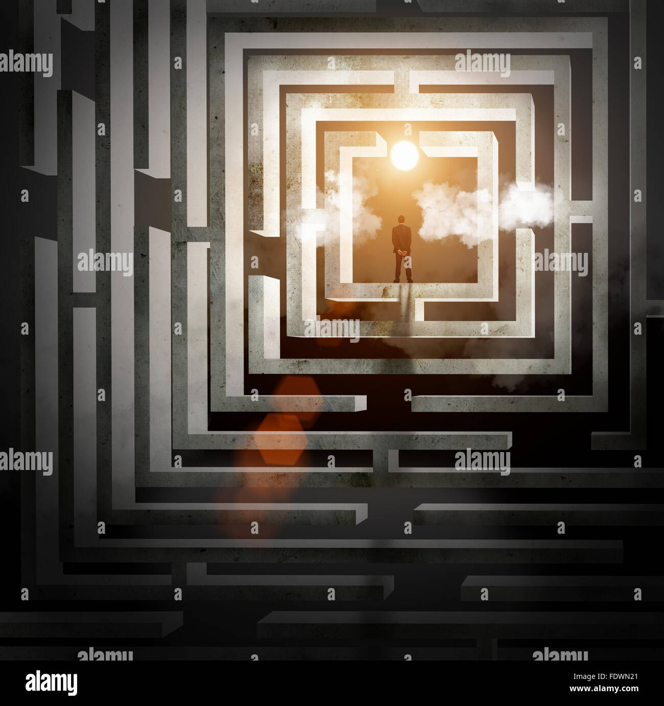 Silhouette of businessman standing in maze sun above Stock Photo - Alamy