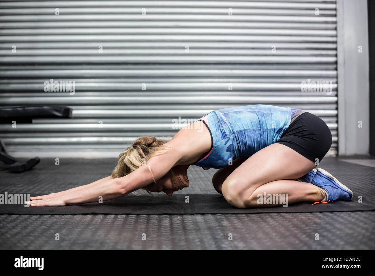 Fit woman doing some stretch Stock Photo - Alamy