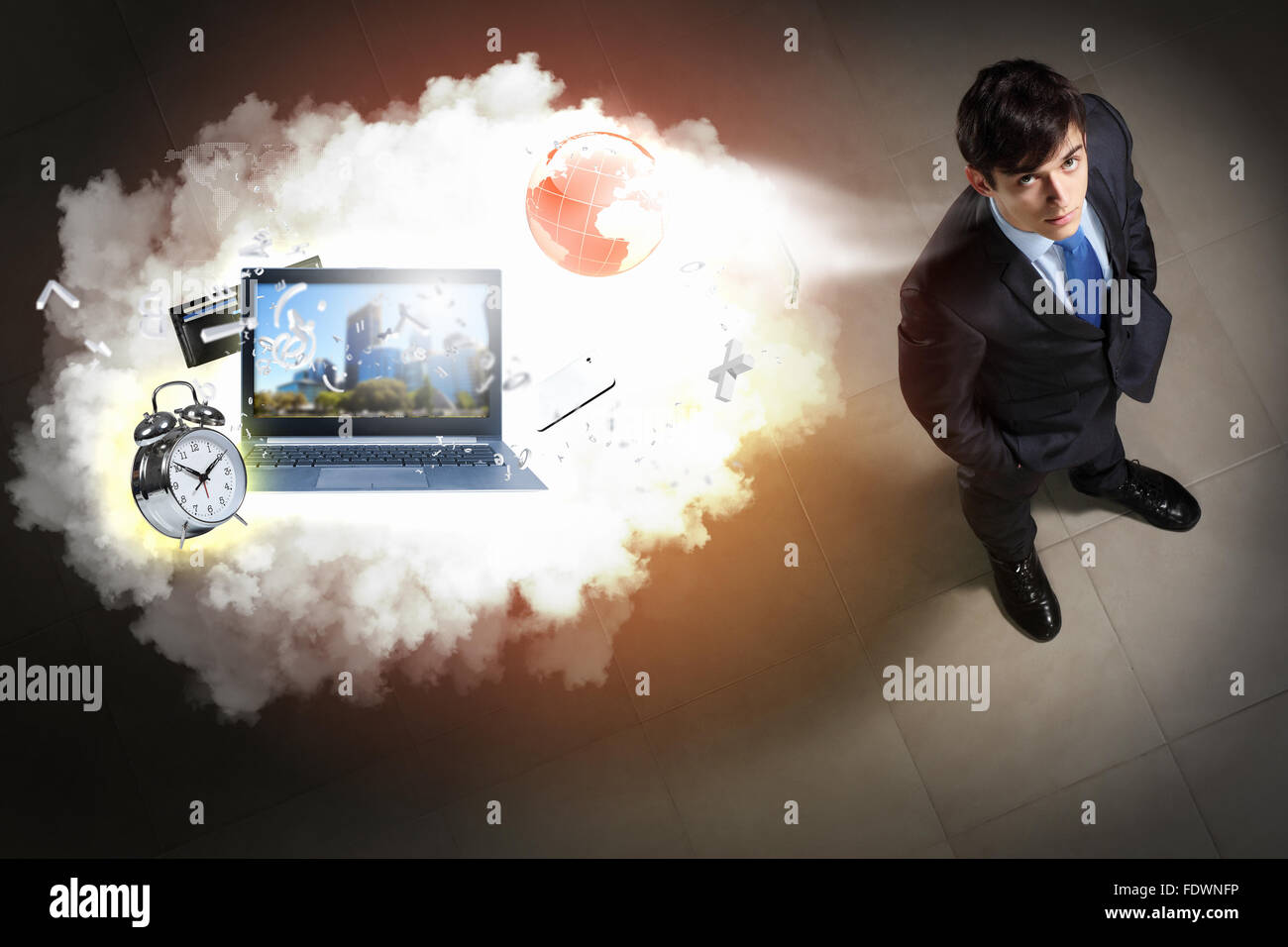 Image of business objects flying in air top view against businessman ...