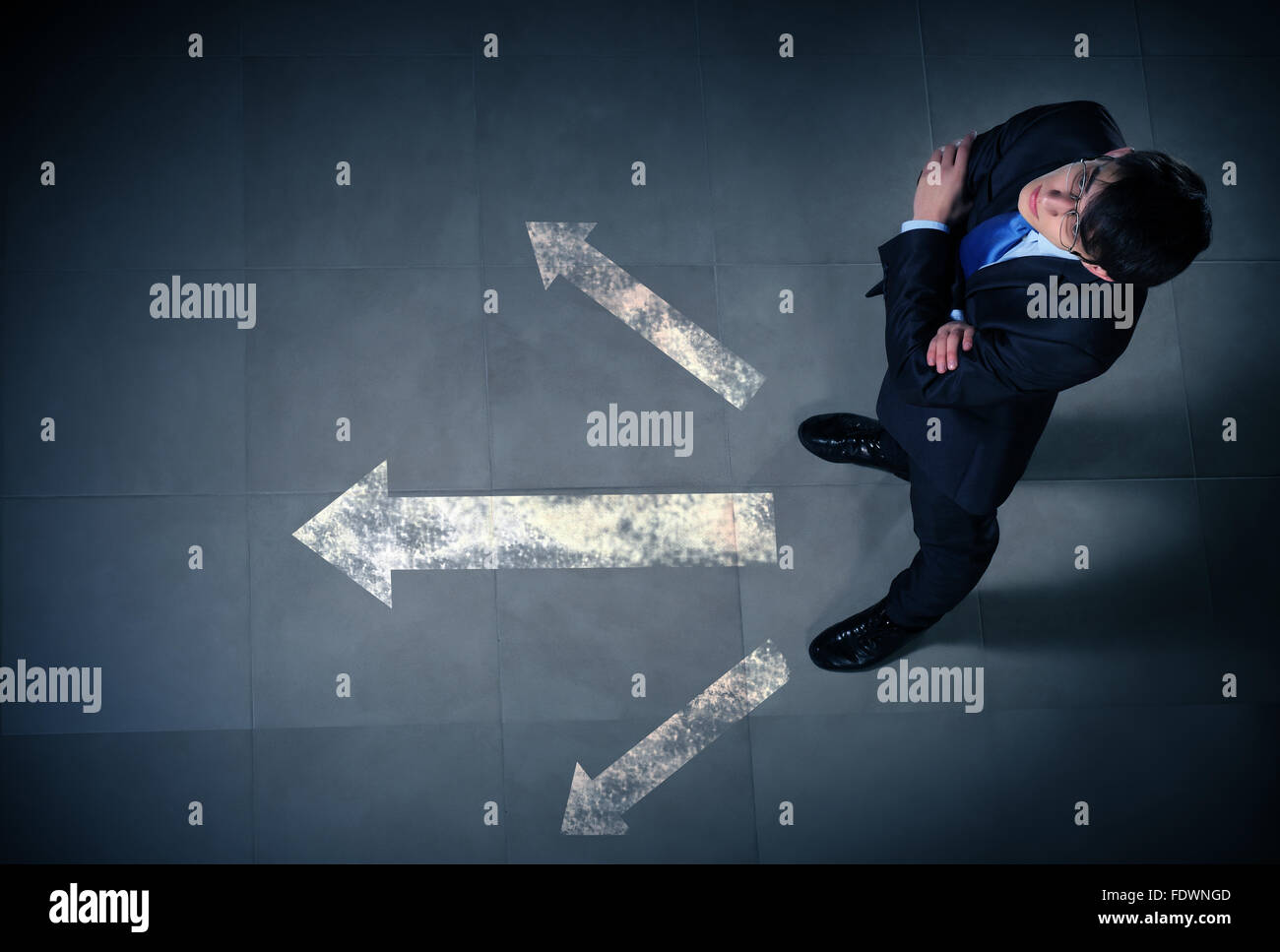 Top view of businessman standing against directions background Stock ...