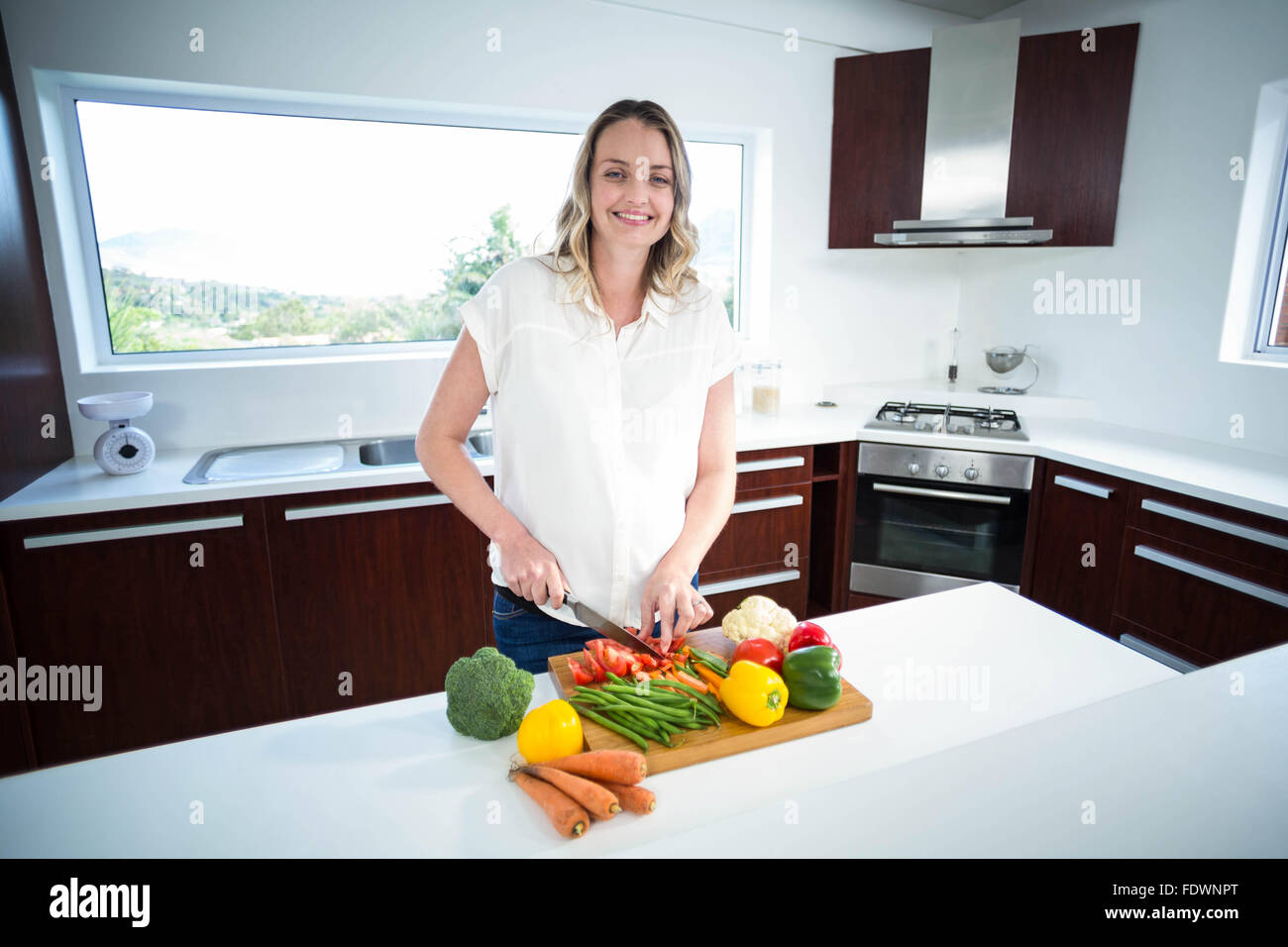 Hand holding knife cutting vegetables hi-res stock photography and ...