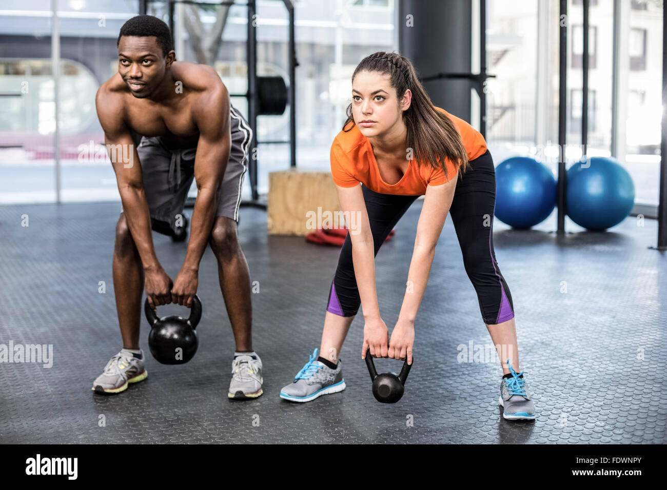 Athletic man and woman working out Stock Photo - Alamy