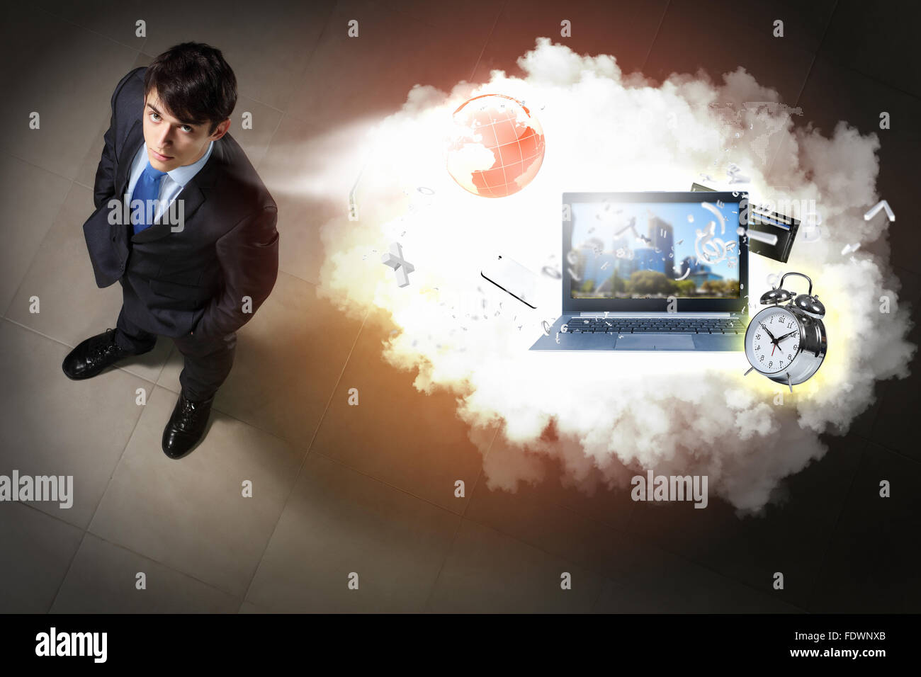 Image of business objects flying in air top view against businessman ...