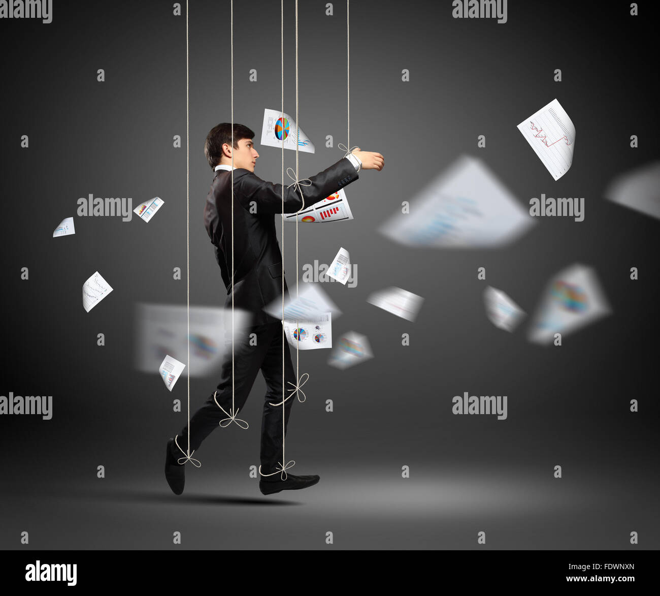Image of businessman hanging on strings like marionette. Conceptual ...