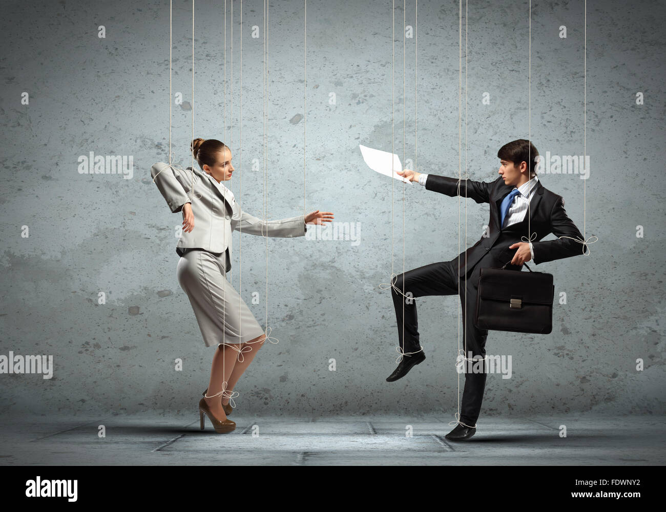 Image of businesspeople hanging on strings like marionettes. Conceptual ...