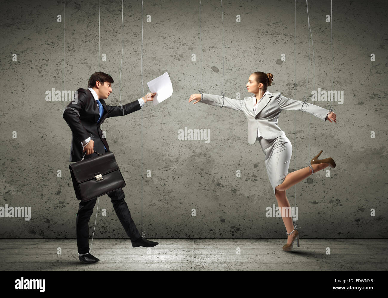Image of businesspeople hanging on strings like marionettes. Conceptual ...