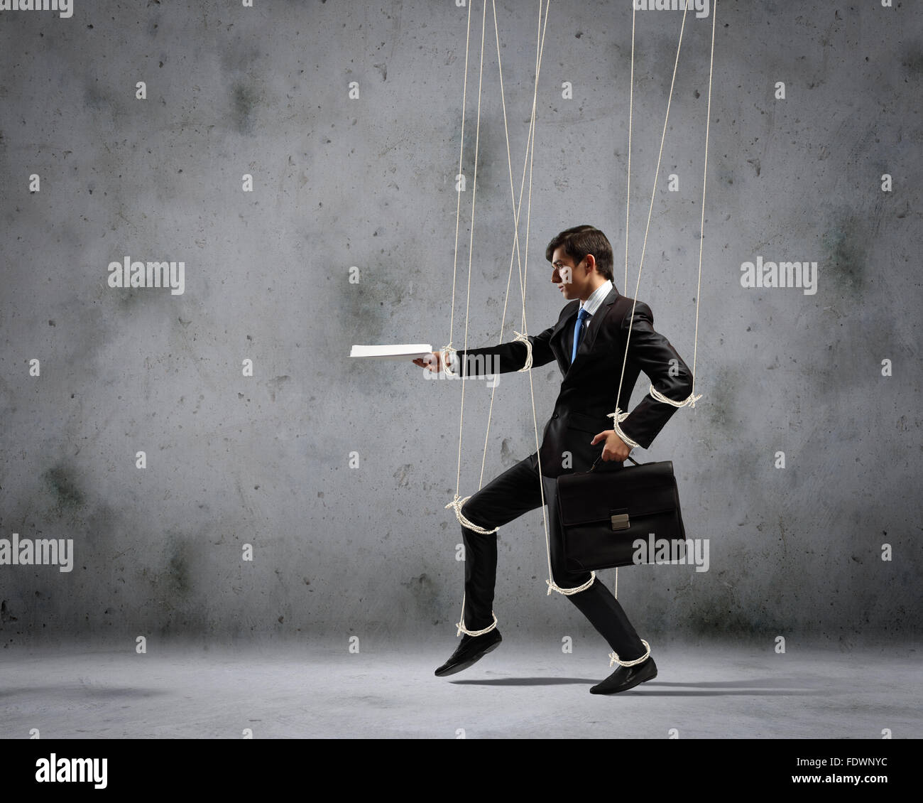 Hand controlling strings puppet businessman hi-res stock photography ...