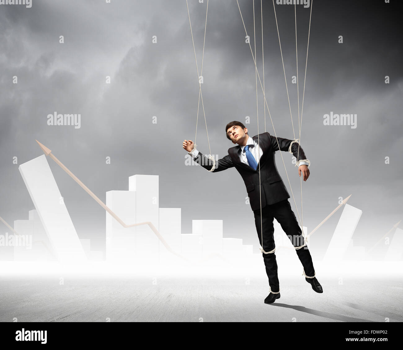 Image of businessman hanging on strings like marionette. Conceptual ...