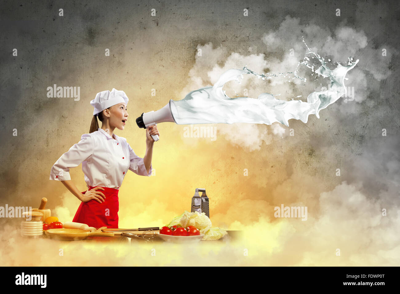 Asian female cook screaming loud in megaphone Stock Photo - Alamy