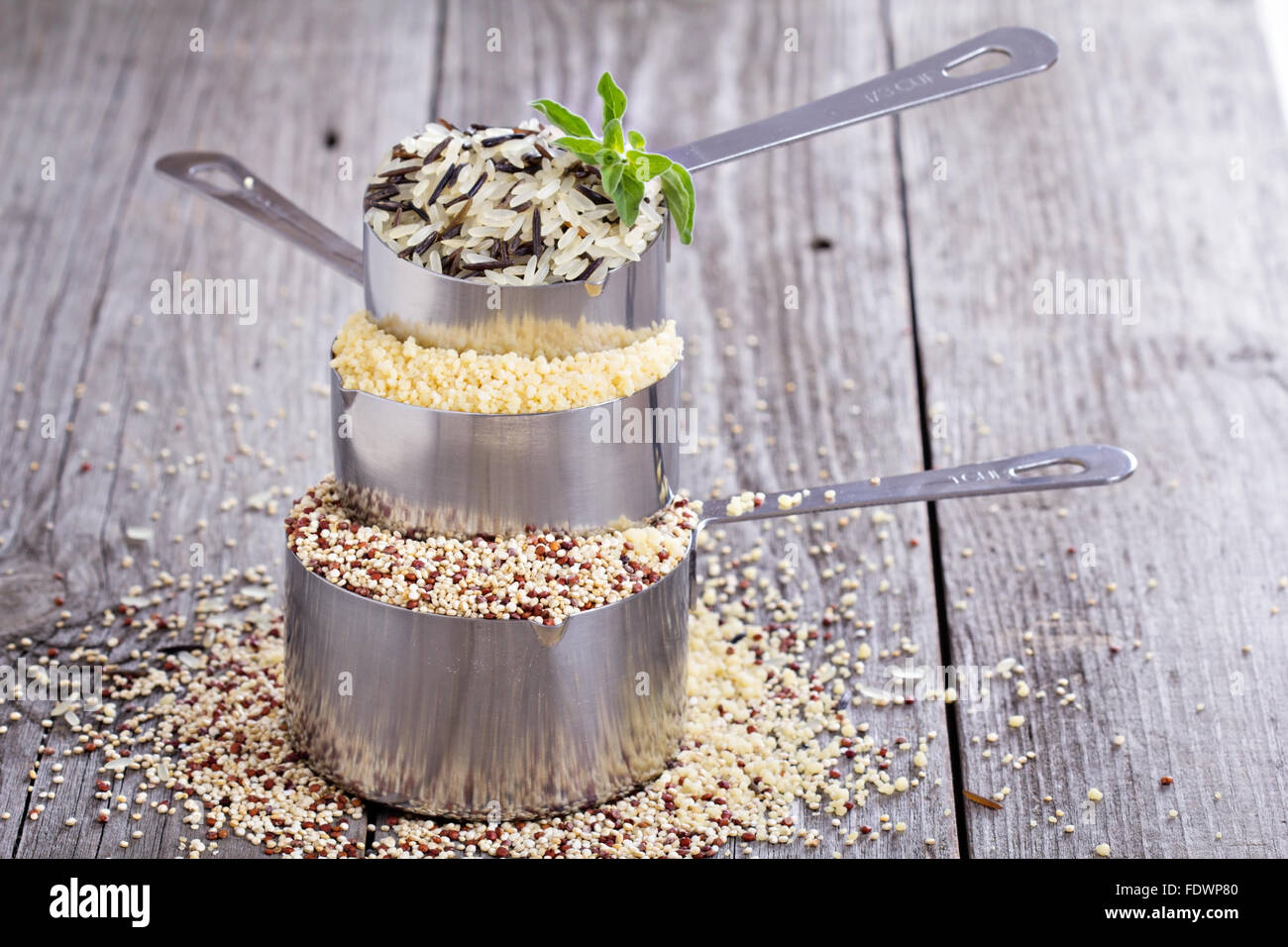 Variety of grains in stacked measuring cups Stock Photo - Alamy