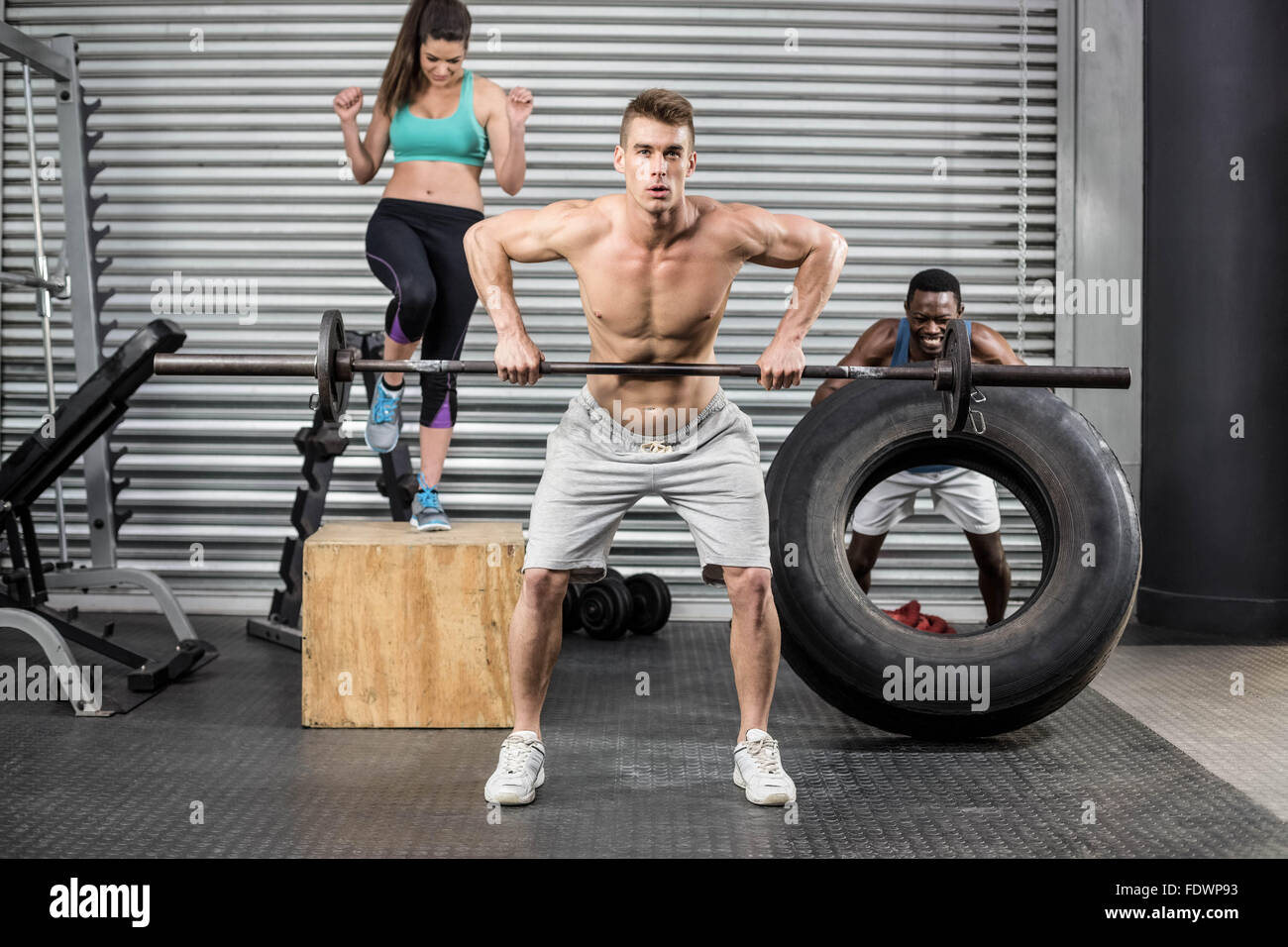 Fit people exercising together Stock Photo - Alamy