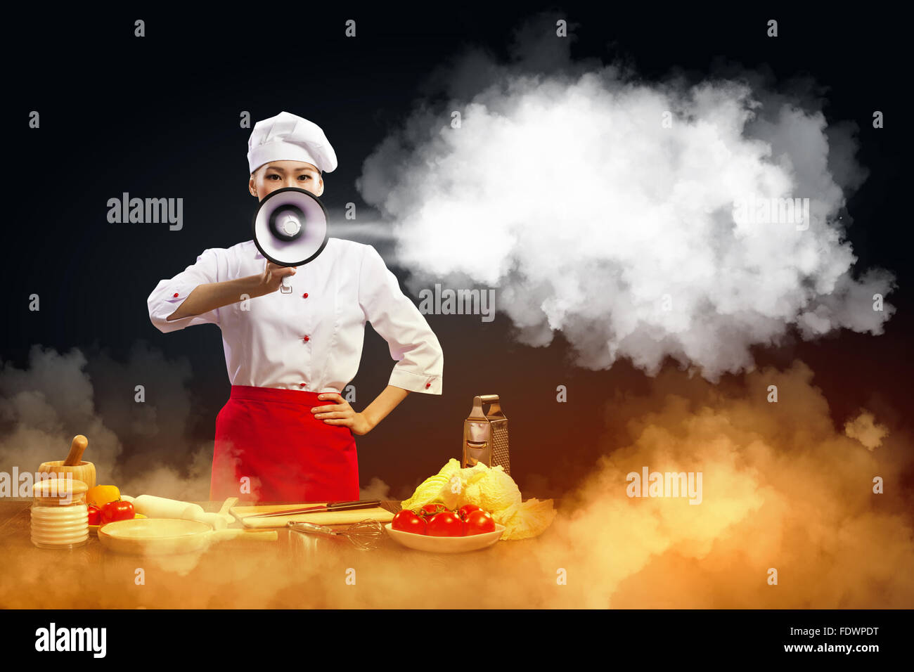 Asian female cook screaming loud in megaphone Stock Photo - Alamy