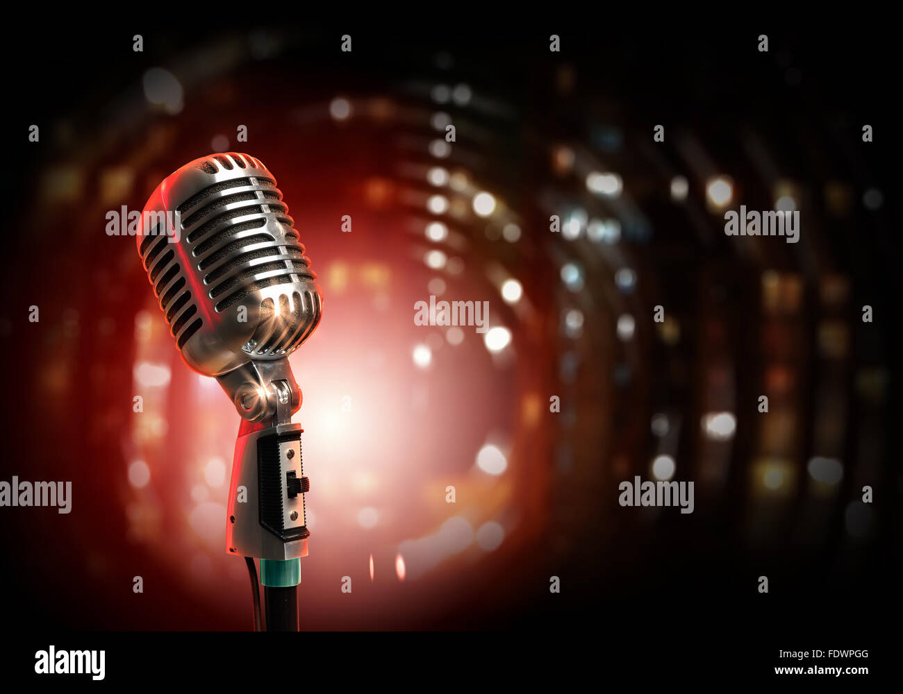 Single retro microphone against colourful background with lights Stock ...