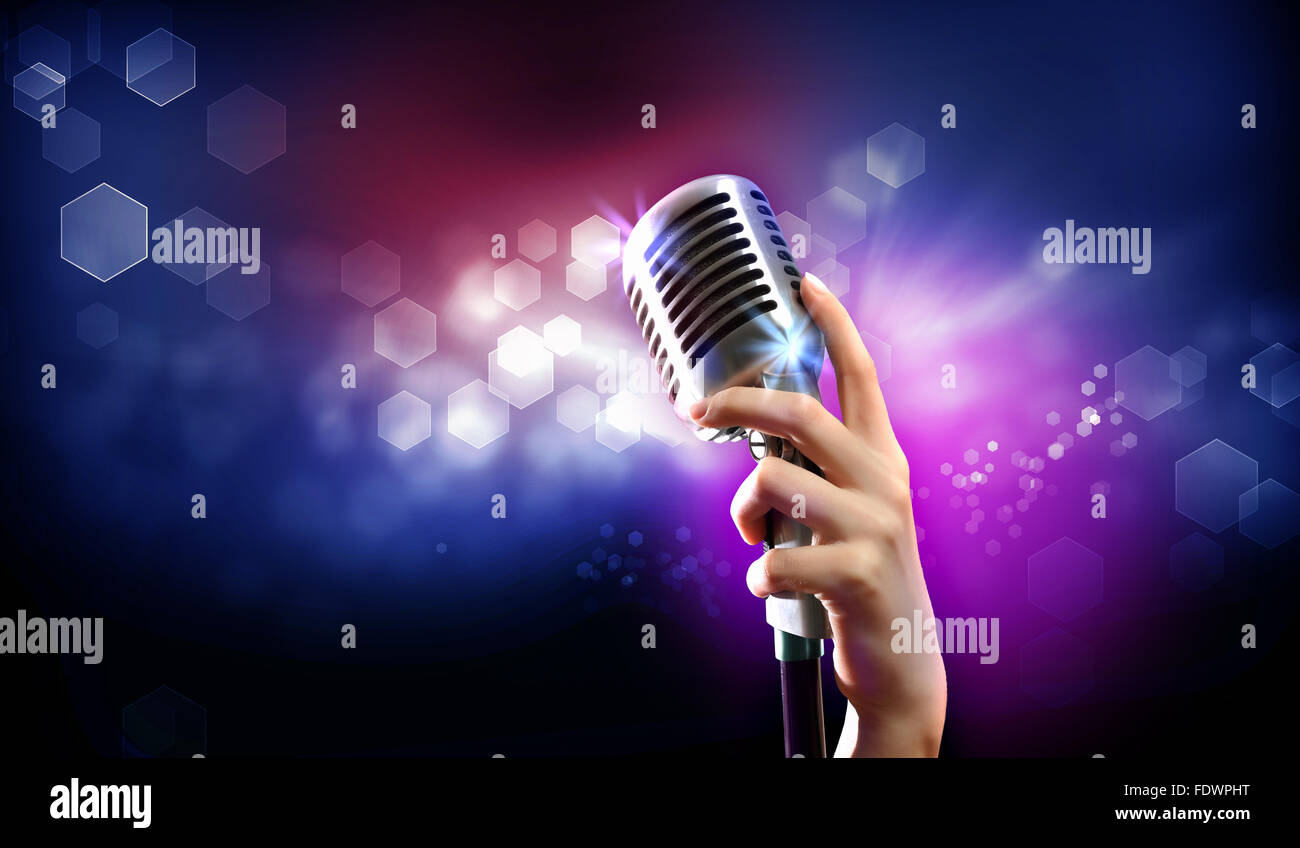 Single retro microphone against colourful background with lights Stock ...