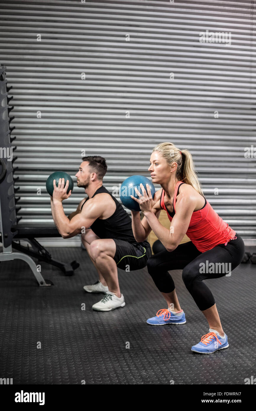 Couple doing ball exercise Stock Photo - Alamy