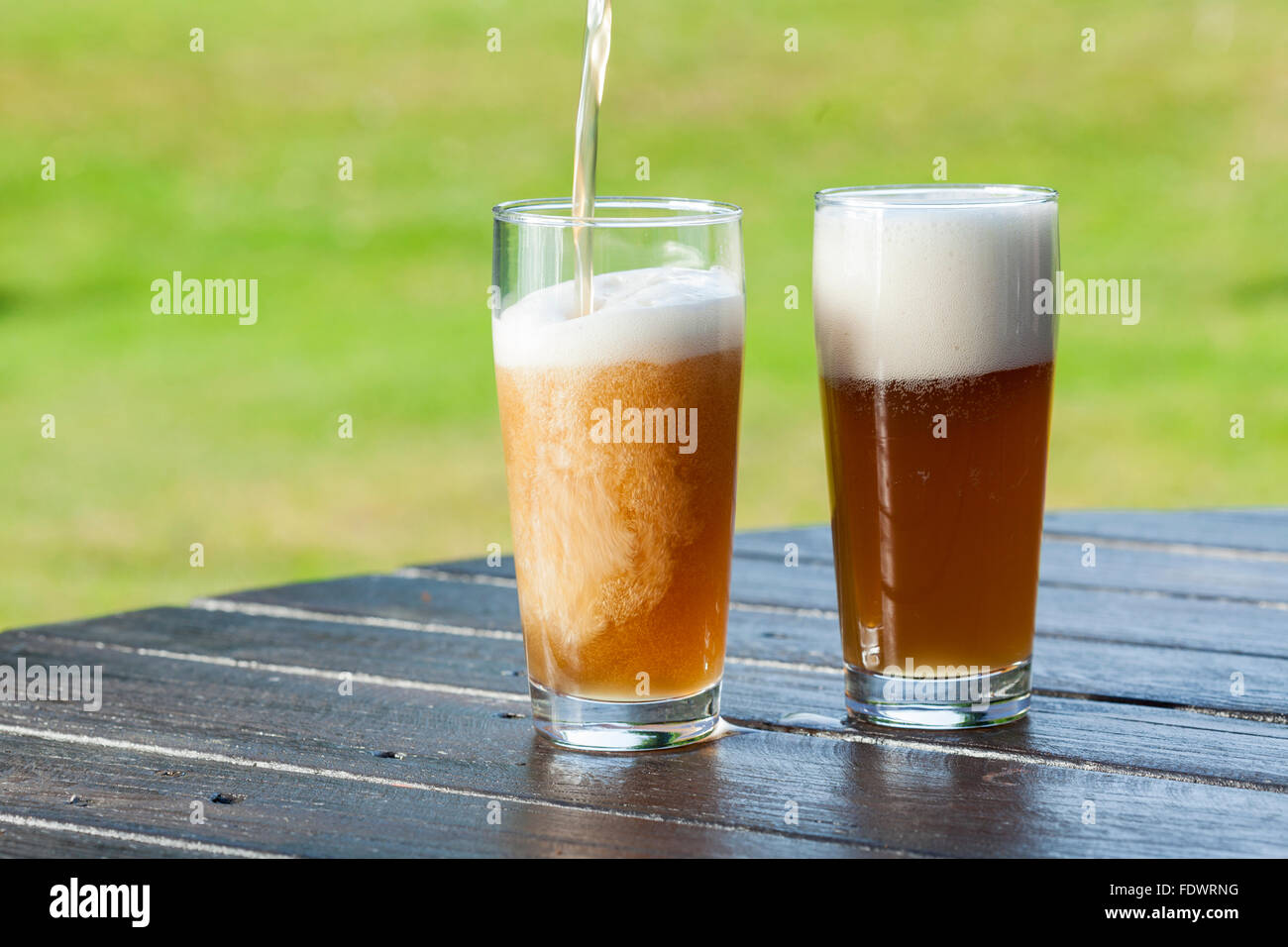 cold german english irish dark beer in summer garden Stock Photo - Alamy