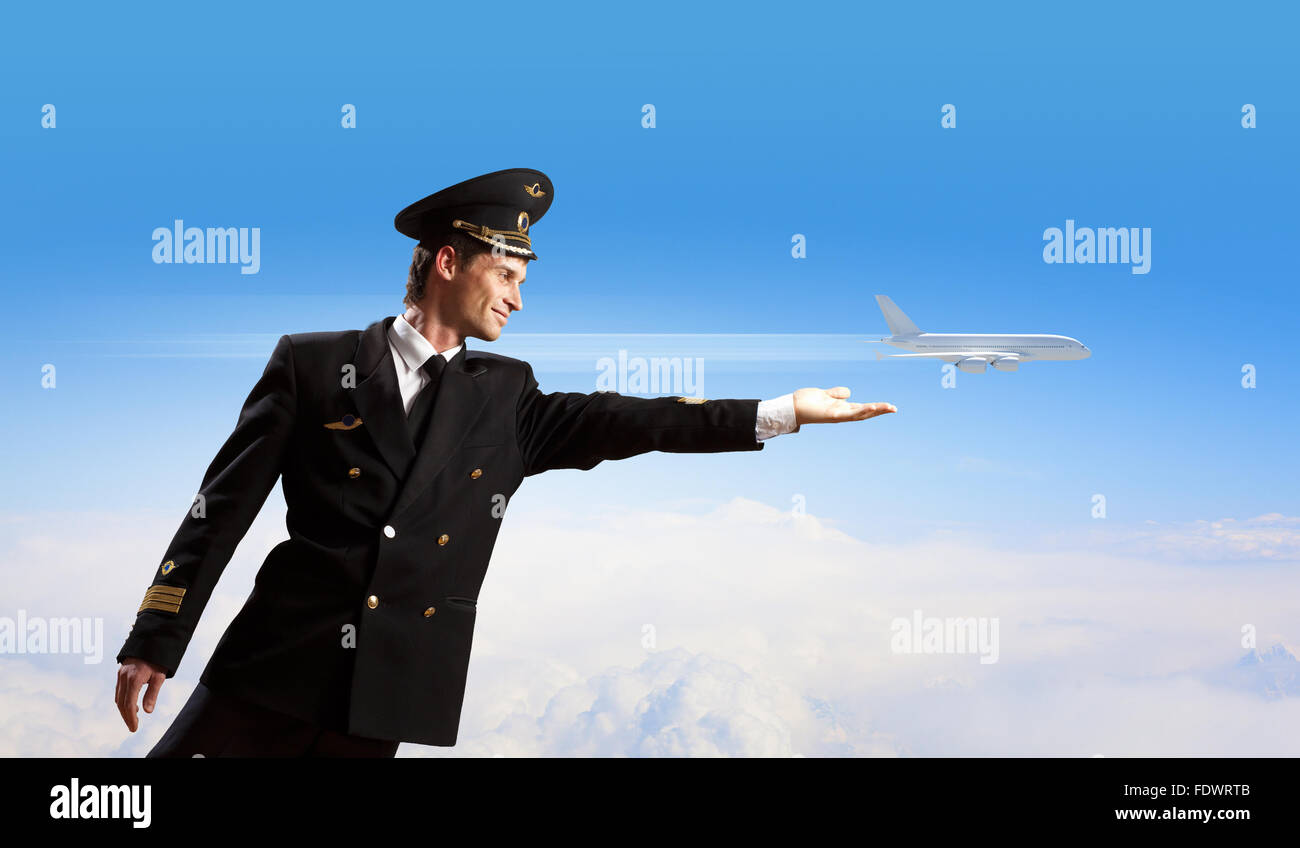 Image of pilot touching sky against airplane background Stock Photo - Alamy