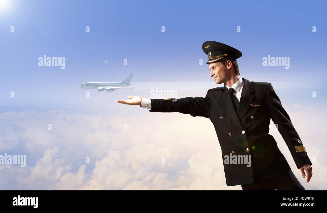 Image of pilot touching sky against airplane background Stock Photo - Alamy