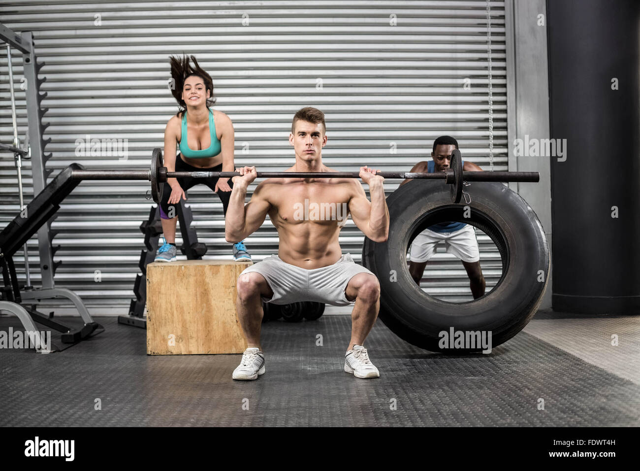 Fit people exercising together Stock Photo - Alamy