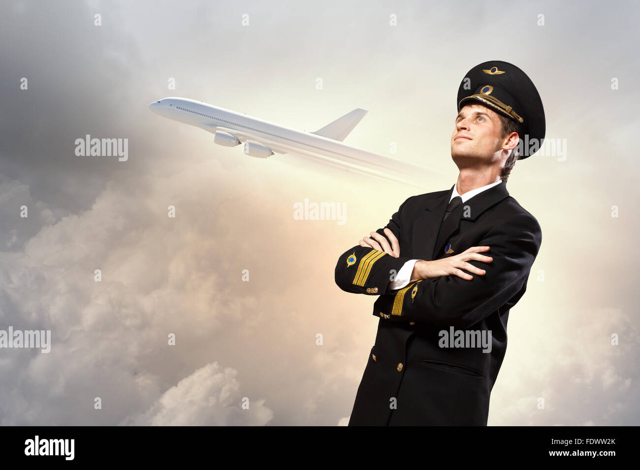 Image of male pilot with airplane at background Stock Photo - Alamy