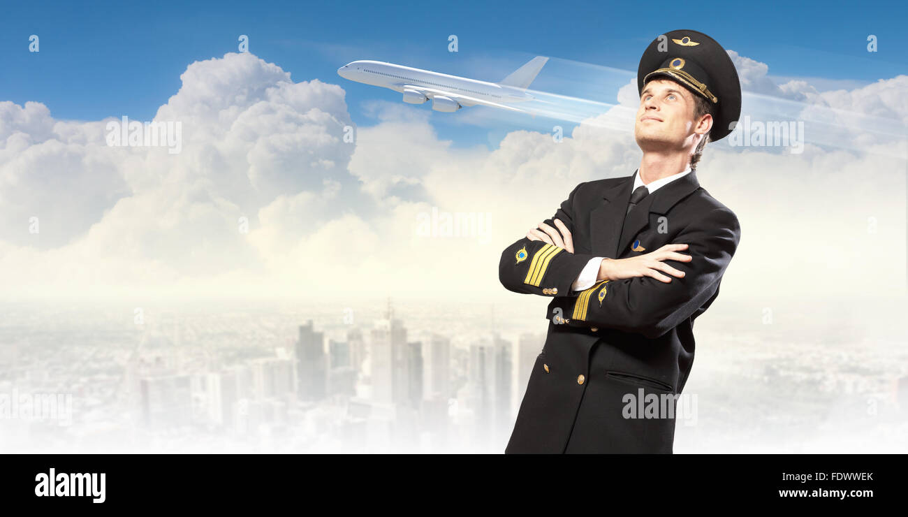 Image of male pilot with airplane at background Stock Photo - Alamy