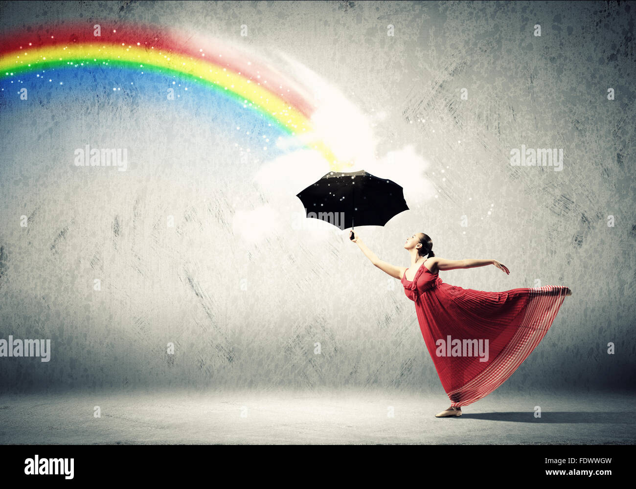 ballet dancer in flying satin dress with umbrella and a rainbow Stock ...