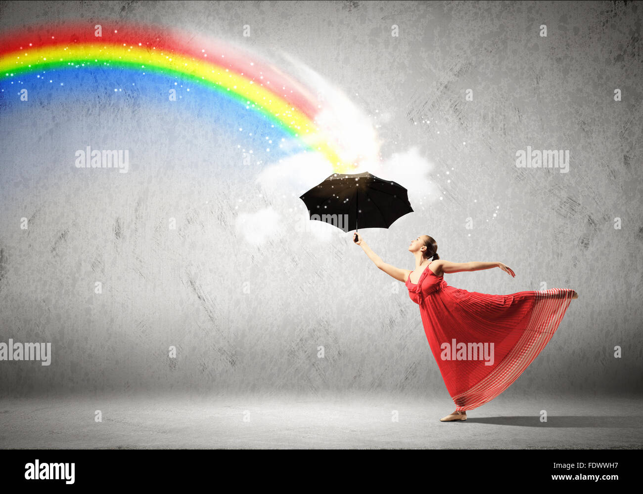 ballet dancer in flying satin dress with umbrella and a rainbow Stock ...