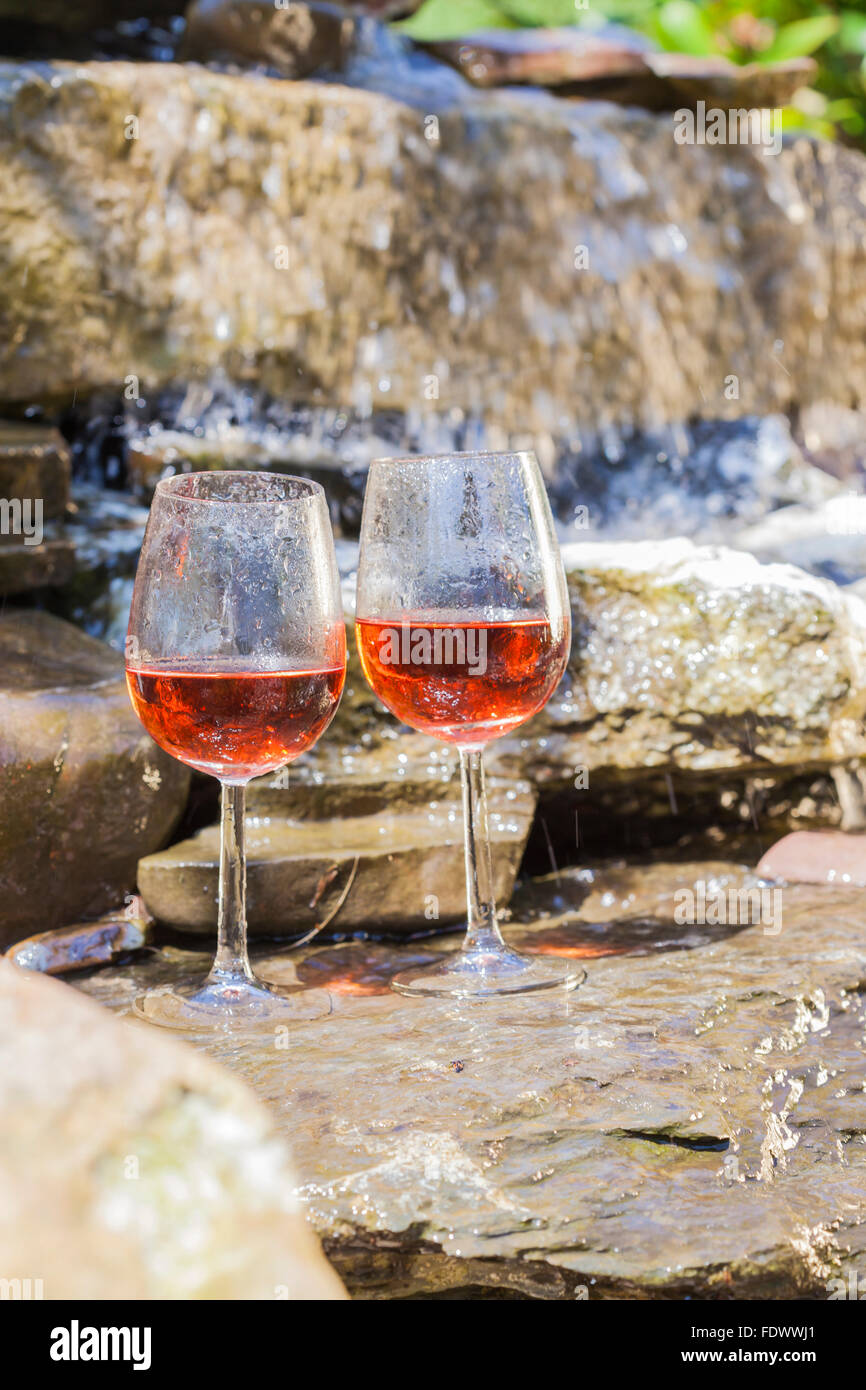 wine cooled in waterfall during hiking break Stock Photo - Alamy