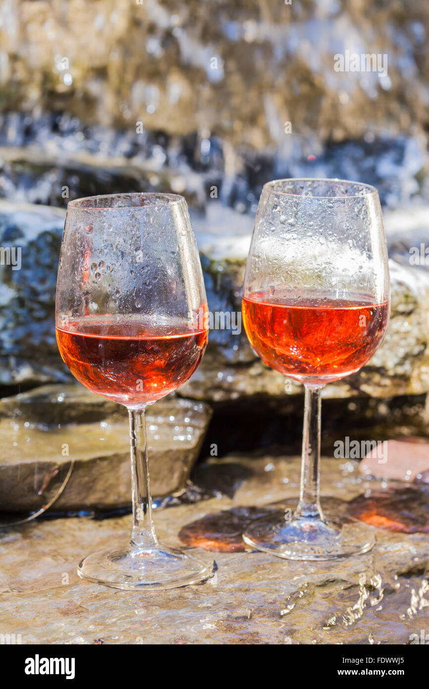 wine cooled in waterfall during hiking break Stock Photo - Alamy