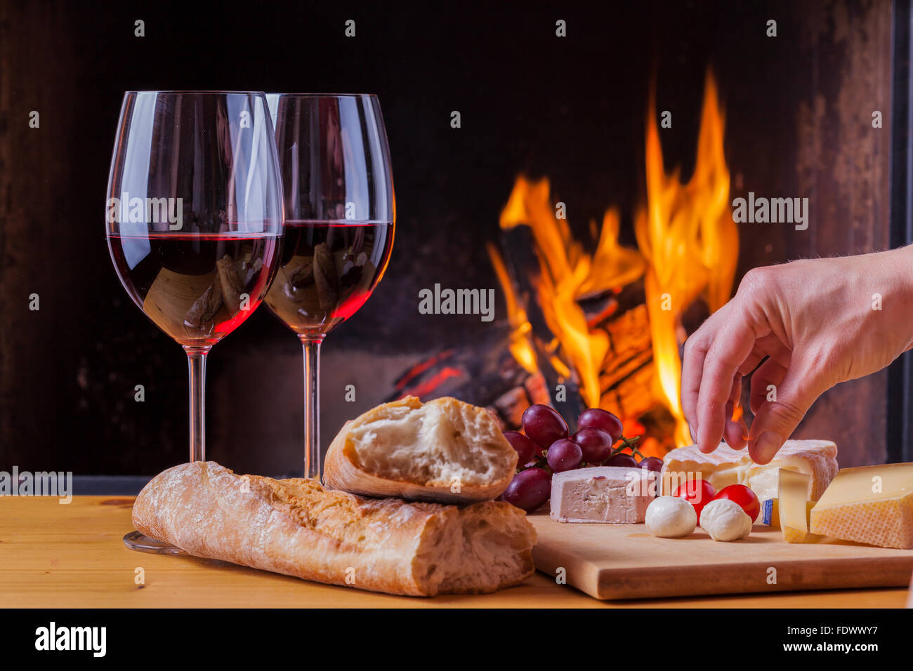 food and drinks at fireplace in winter Stock Photo - Alamy