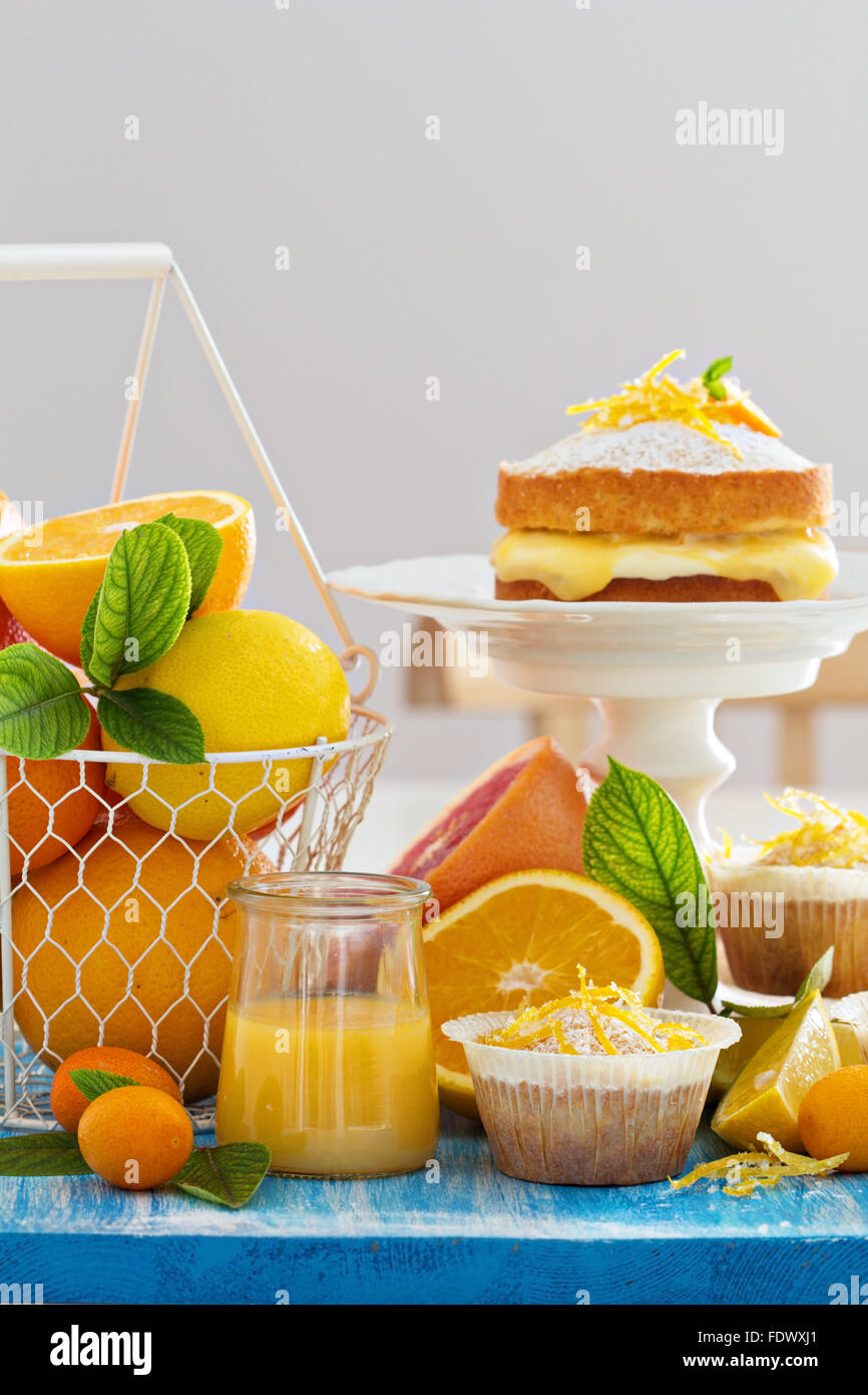 Citrus candy bar with fresh citrus fruits and cakes Stock Photo - Alamy