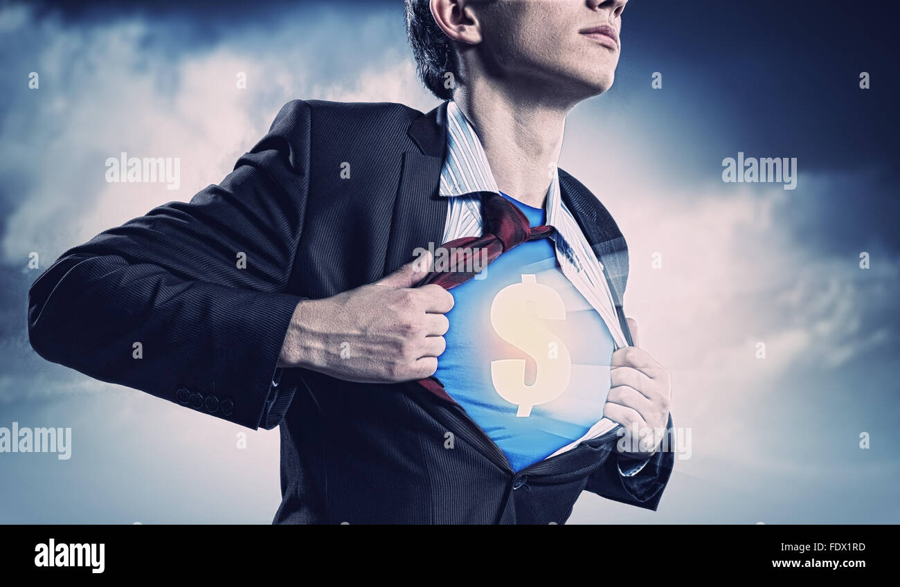 Image of young businessman in superhero suit with dollar sign on chest ...