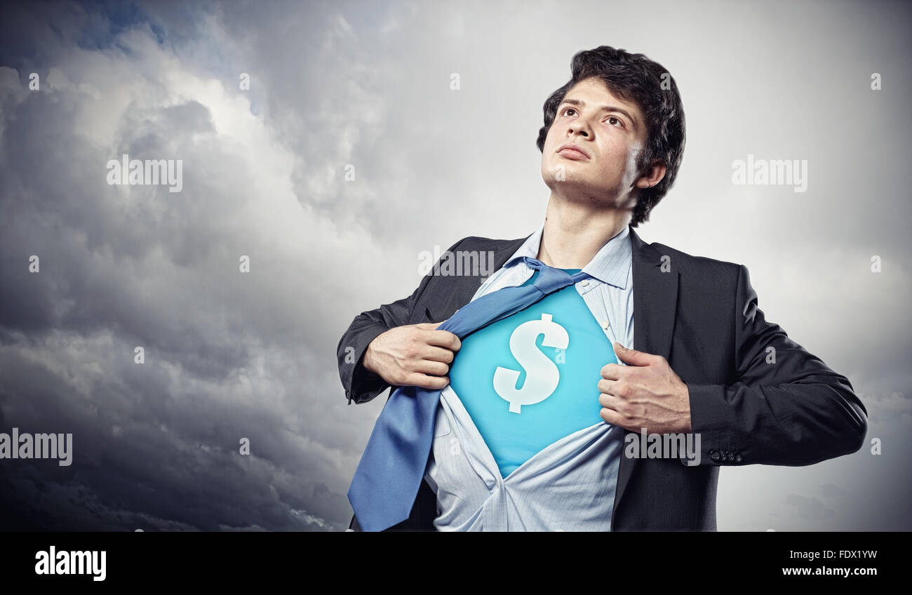 Image of young businessman in superhero suit with dollar sign on chest ...