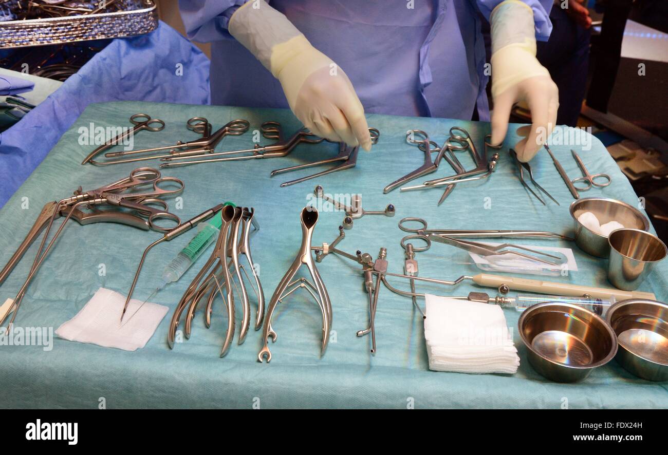 A nurse perpares instruments for an operation, in an ultramodern ...